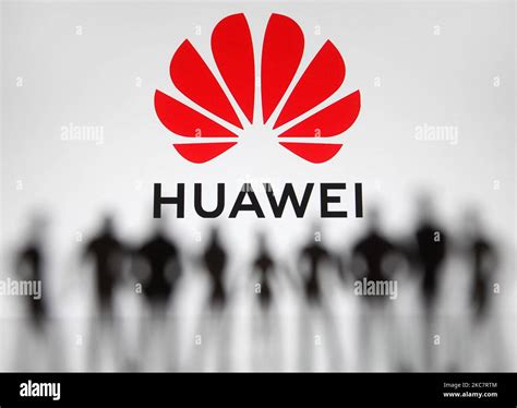 This Illustration Picture Taken On 19 January 2021 Shows The Huawei Logo In Front Of Silhouettes