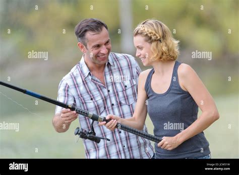 Woman Learning To Fish Stock Photo Alamy