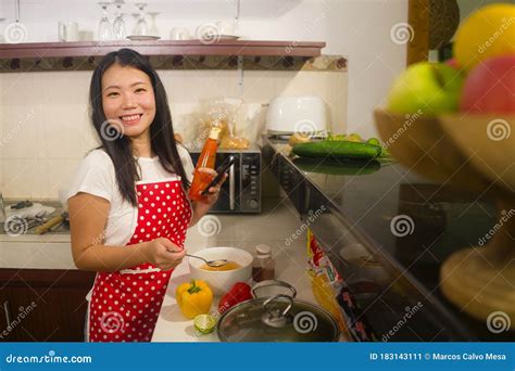 Cheerful Domestic Cooking Young Happy And Beautiful Asian Chinese