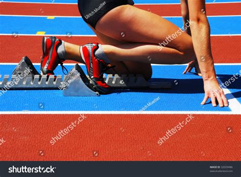 Woman In A Starting Block On An Athletic Field Stock Photo Shutterstock