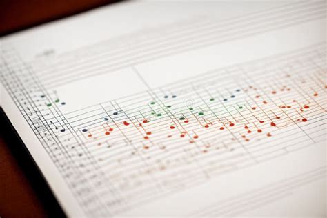 A Music Note On A Sheet Transforming Into A Symphony Of Colors Stock