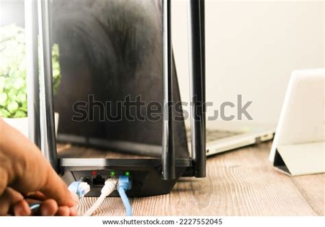 Man Plugs Internet Cable Into Router Stock Photo 2227552045 Shutterstock