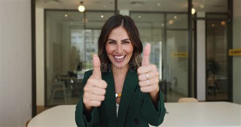 Headshot Portrait Of Cheerful Businesswoman Gives Two Thumbs Up Stock