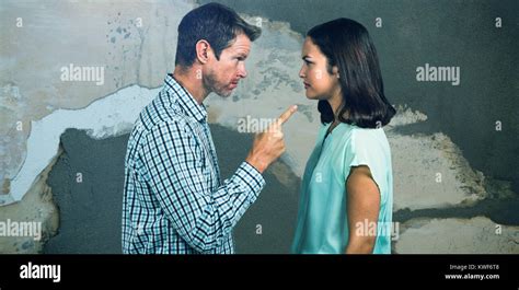Composite Image Of Side View Of Man Pointing Woman While Arguing Stock Photo Alamy