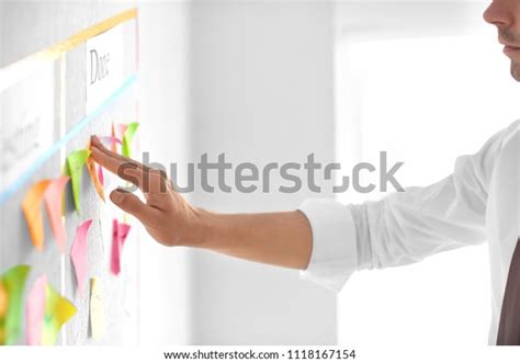 Man Attaching Sticky Note Scrum Task Stock Photo Edit Now 1118167154