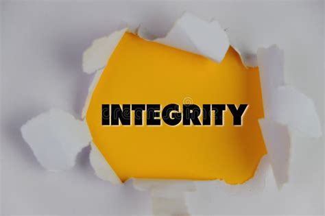 Text Of Integrity Seen Through A Hole In Ripped White And Yellow Paper