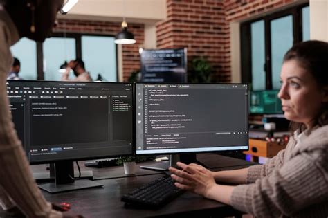 Premium Photo Programmers Looking For Source Of Cyber Attacks And System Security Coverage