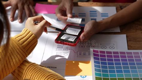 Ux Developer And Ui Designer Brainstorming About App Interface Design At Modern Office Creative