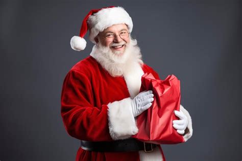 Premium Photo Miling Santa Claus Holding Bag With Ts Looks Happy