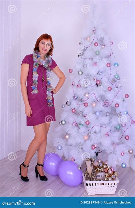 Legged Redhead Model In Minidress And Stockings In Studio Stock Image Image Of Cristmastree
