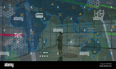 Female Data Analyst Wearing Blazer Monitoring Curved Screen In Control Room With Map Overlay
