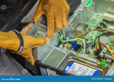 CPU In Hands Of A Technician The Processor Is Being Examined For Apparent Defects In Modern