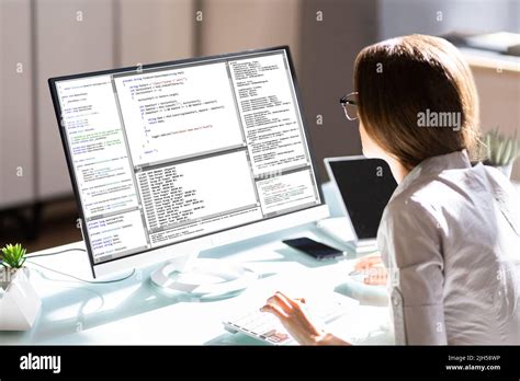 Female Programmer Working On Computer Screen In Office Stock Photo Alamy