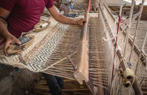 Premium Photo Midsection Of Man Weaving Textile