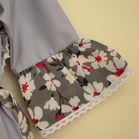 قیمت و خرید ست پیراهن و کلاه دخترانه مدل دو تیکه گلدار آستین کلوش رنگ طوسی