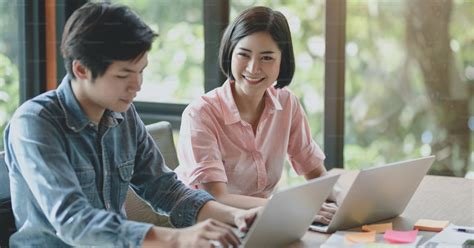 Team Of Ui Web Developer Working On Their Project On Smartphone