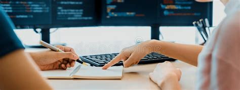 Female Programer Taking A Note While Web Developer Present Program