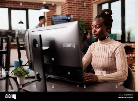 African American Tech Enginner Typing Big Data Code On Computer Developing Program Using Html