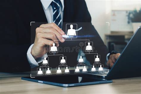 Businessman Touching Organization Chart With Hierarchy Structure Of Teams And Employees In