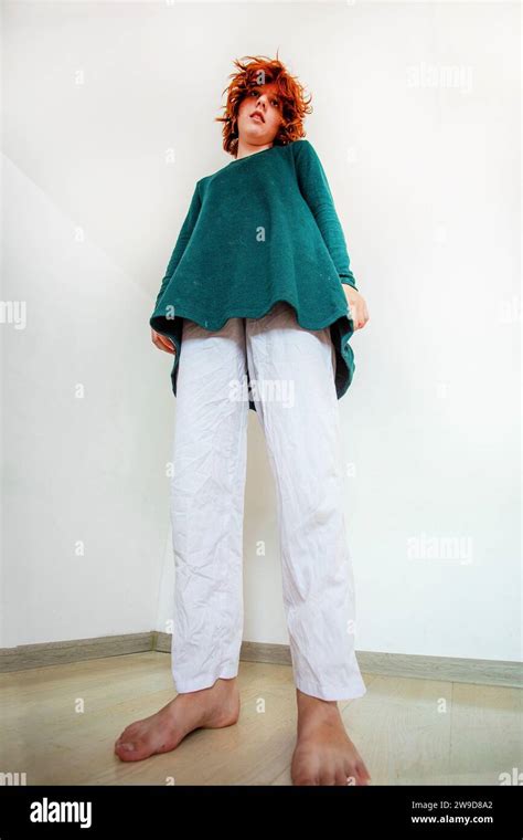 Tenager Girl Stands Barefoot On The Parquet Floor In Her Room After