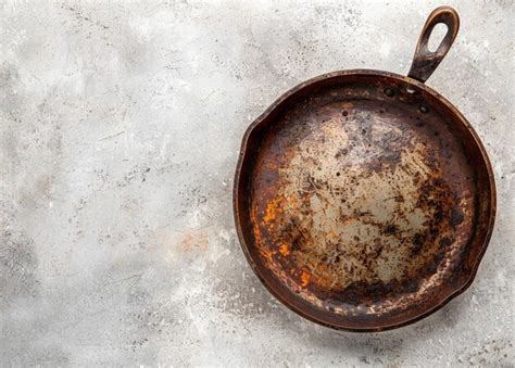 There Is A Rusty Pan On A Dirty Surface With A Handle Generative Ai