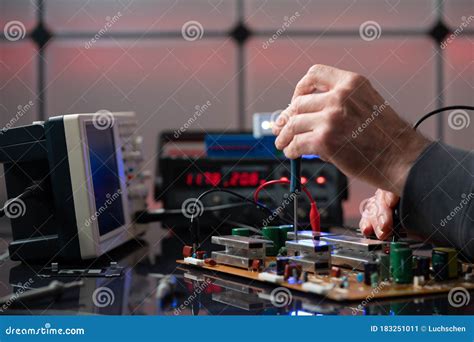 Debugging Electronics Device PCB Witch Microcontroller In Electronics Laboratory Stock Image