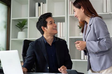 Collaboration And Teamwork Colleagues Engaging In A Productive Conversation In A Modern Office