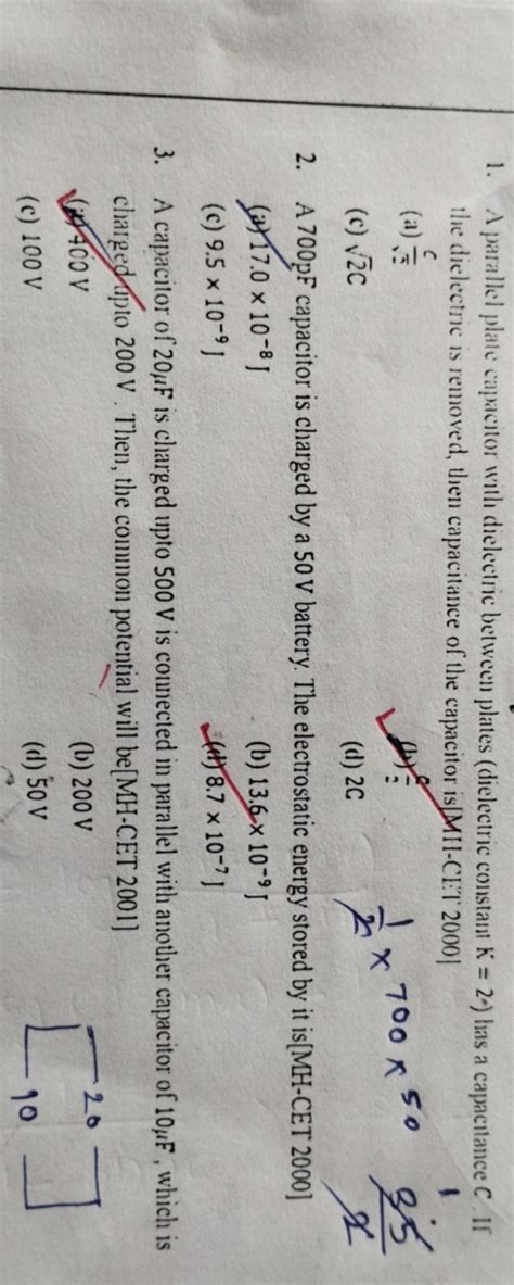 1 A Parallel Plate Capacitor Wilı Dielectric Between Plates Dielectric