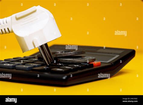 Electricity Growth Concept Calculator And AC Power Plug Stock Photo Alamy