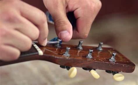 How To String A Guitar Like A Pro So It Wont Slip Out Of Tune