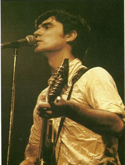 Download David Byrne Talking Heads 1977 Poster Wallpaper