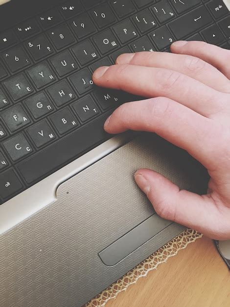 Premium Photo Cropped Image Of Hand Using Laptop
