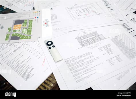 A Pile Of Spread Out Floor Plan And Neighborhood Plot Papers And A