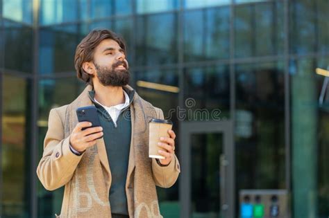 Happy Indian Business Man Tourist Enjoying Morning Coffee Hot Drink Sitting On City Downtown