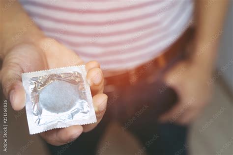 Condom Ready To Use In Female Hand Give Condom Safe Sex Concept On The