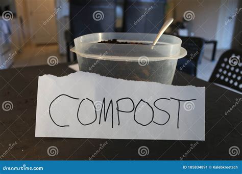 Photo Of A Container Of Used Coffee Grounds With A Sign That Says Compost Stock Image Image Of