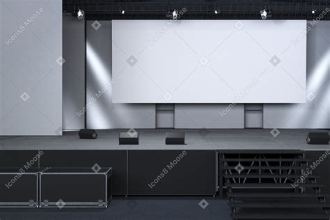 프로젝션 스크린과 조명 장비가 있는 검은색 무대 사진