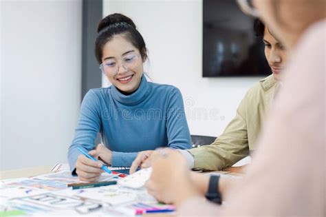 Creative Team Collaborating On Ux Ui Design Project In Modern Office Environment Stock Image