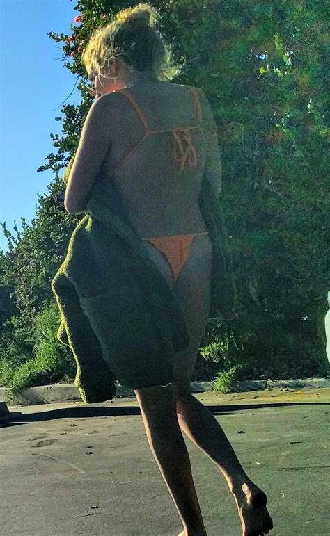 Neon Orange Thong Rolling On Her Side For Us Beach And Bikini Forum