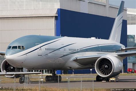 Boeing 777 2kqlr Aircraft Parked Near Blue Doors And Windows