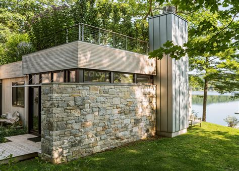 allee separates lakeside connecticut house into two distinct volumes