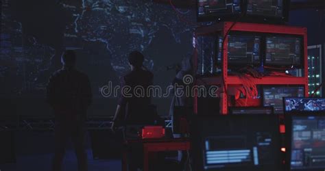 hackers working together in front of world map stock video video of