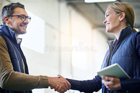 They Make A Great Managerial Team Two Managers Shaking Hands Together