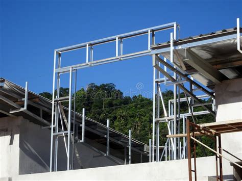 Installation Of The Aluminum Cladding Frame At The End Of The Roof Is