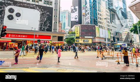 Crowded Busy Intersection In Shopping District Of Causeway Bay In Hong