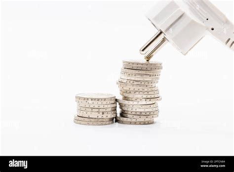 stack of ascending coins and electric plug concept of the increasing