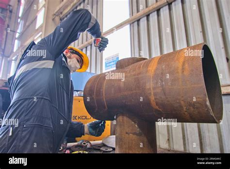Worker Does Measurement Of Diameter Of A Pipe Man Doing Measurement On A Metal Pipe Stock Photo