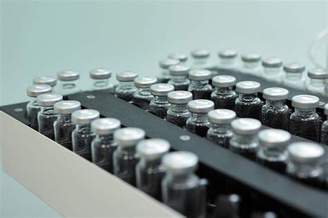 Premium Photo Sterile Capsules For Injection Bottles On The Bottling