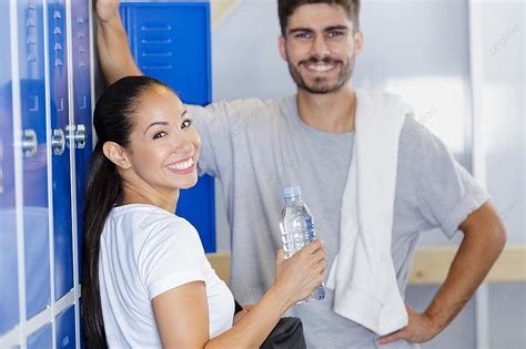 Couple Standing And Talking In Gyms Locker Room Photo Background And