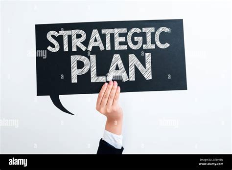 Hand Writing Sign Strategic PlanA Process Of Defining Strategy And